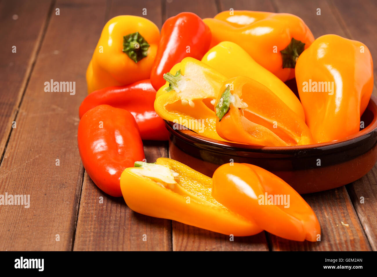 Small bell peppers in red and orange Stock Photo - Alamy