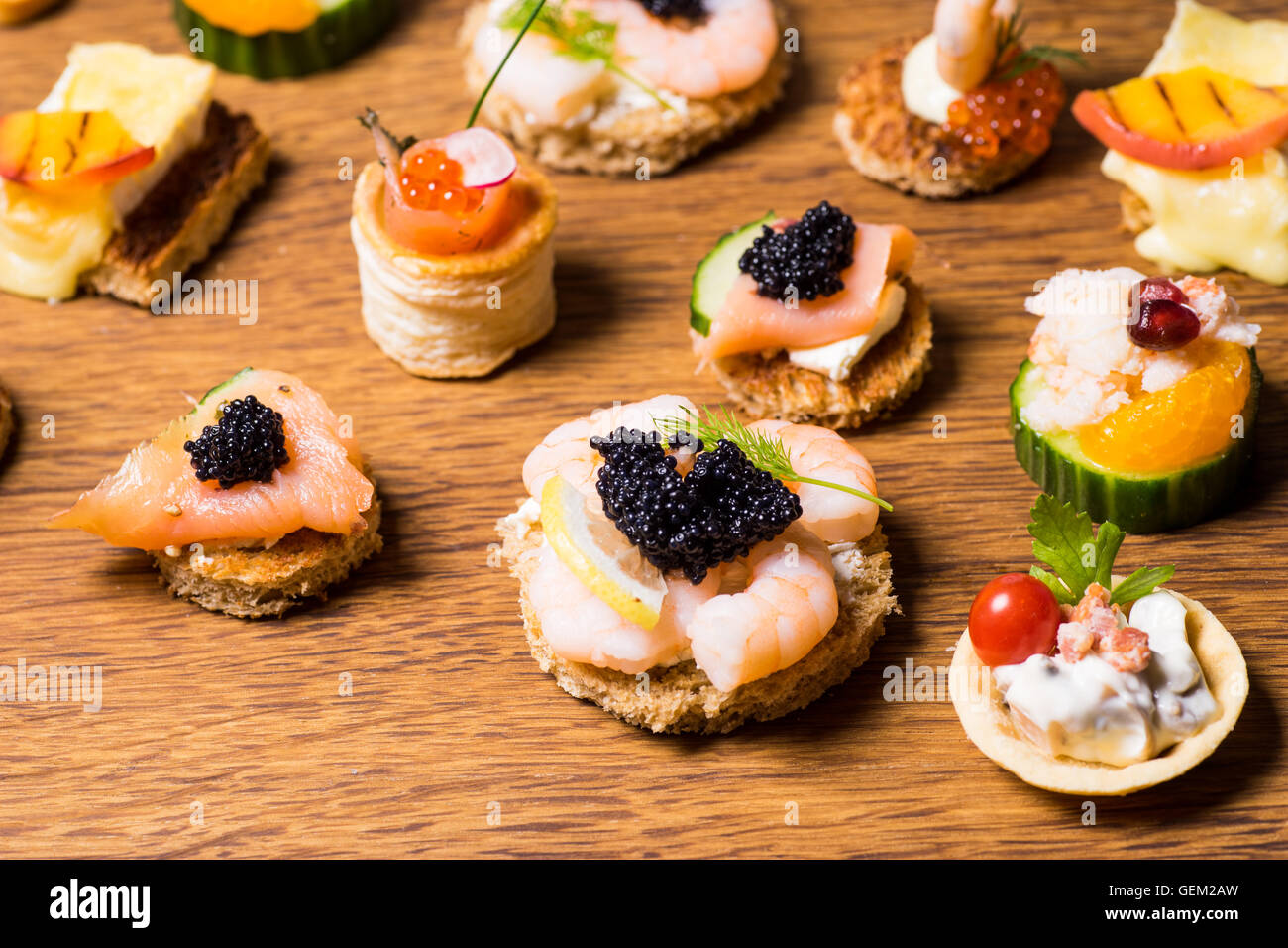 Exquisite selection of luxury canapes, appetizer ready to be served for ...