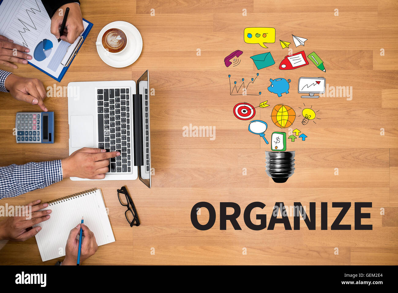 ORGANIZE Business team hands at work with financial reports and a ...