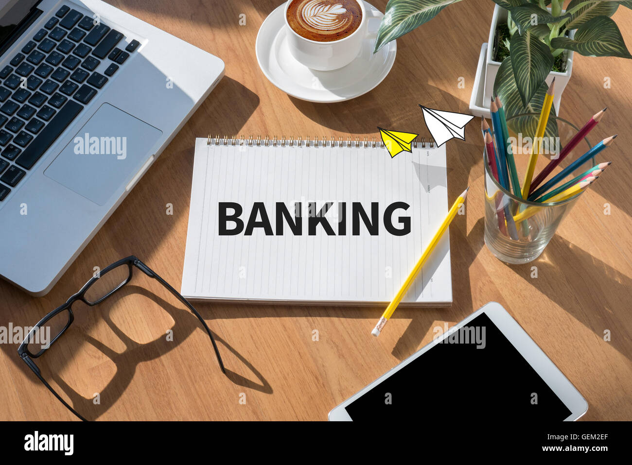 BANKING open book on table and coffee Business Stock Photo - Alamy