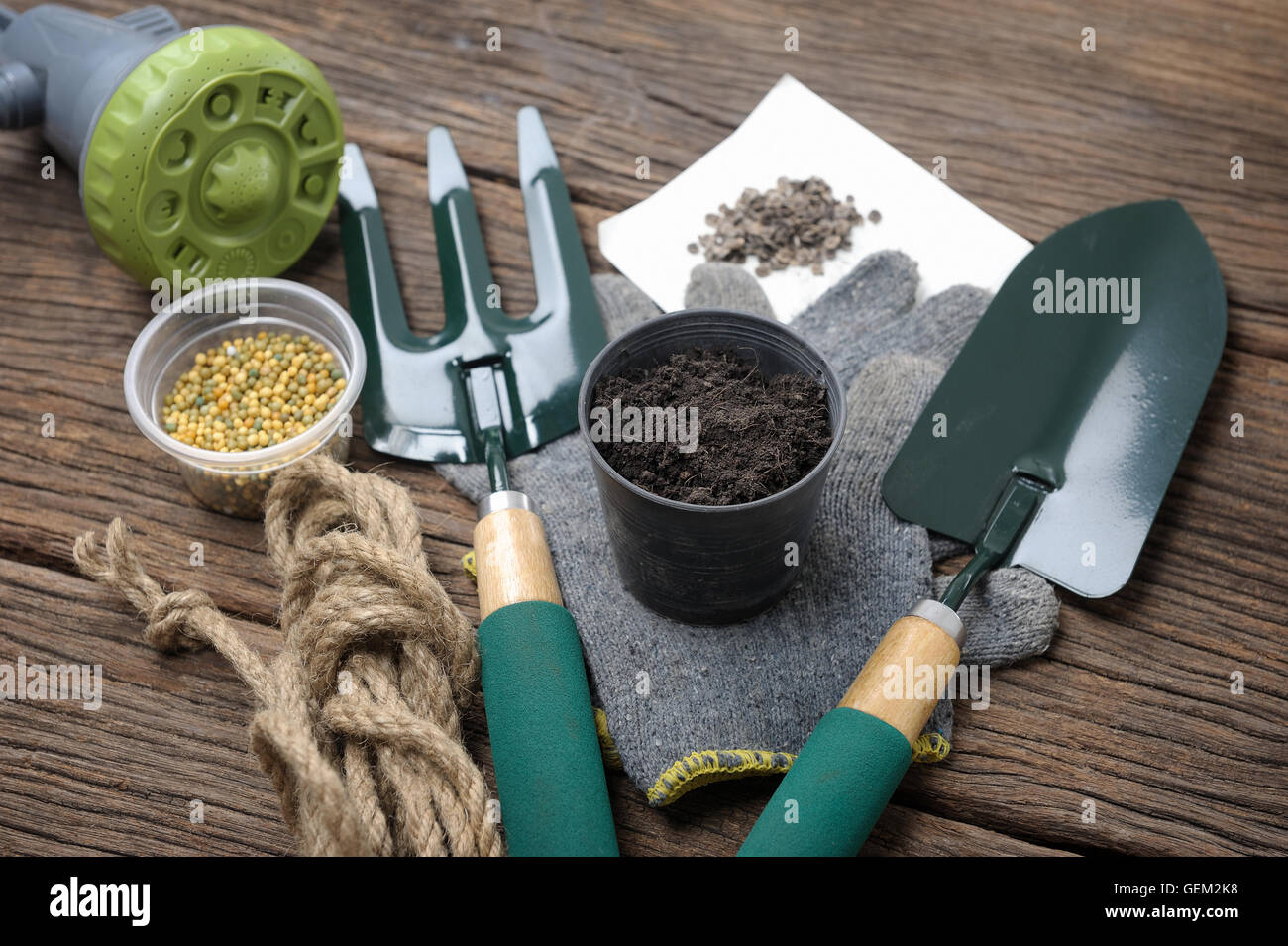 gardening tools and black soil Stock Photo - Alamy