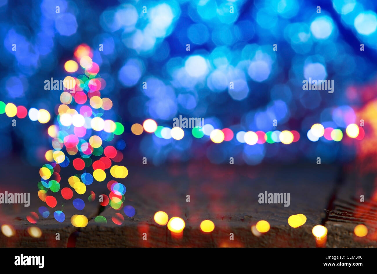 blue unfocused background with colored christmas tree Stock Photo - Alamy