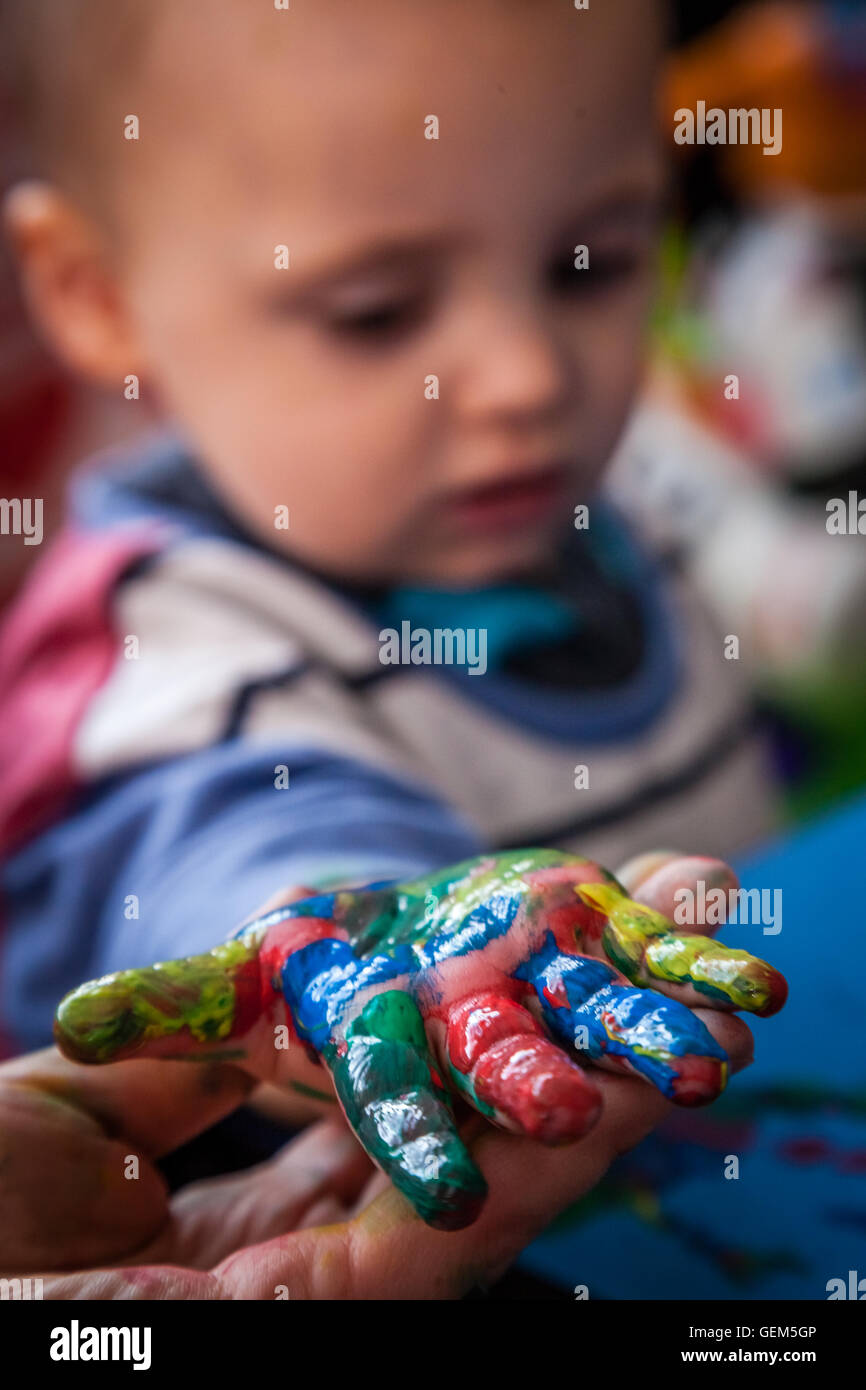 Child's hand with colored fingers from using paint Stock Photo - Alamy