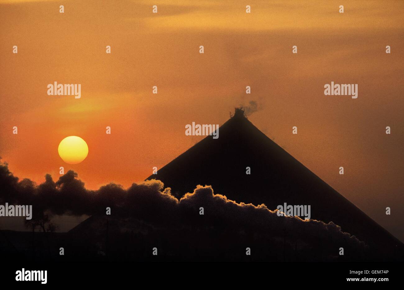 Sun rising behind slag tip - steam train passing A scene on the Teifa ...