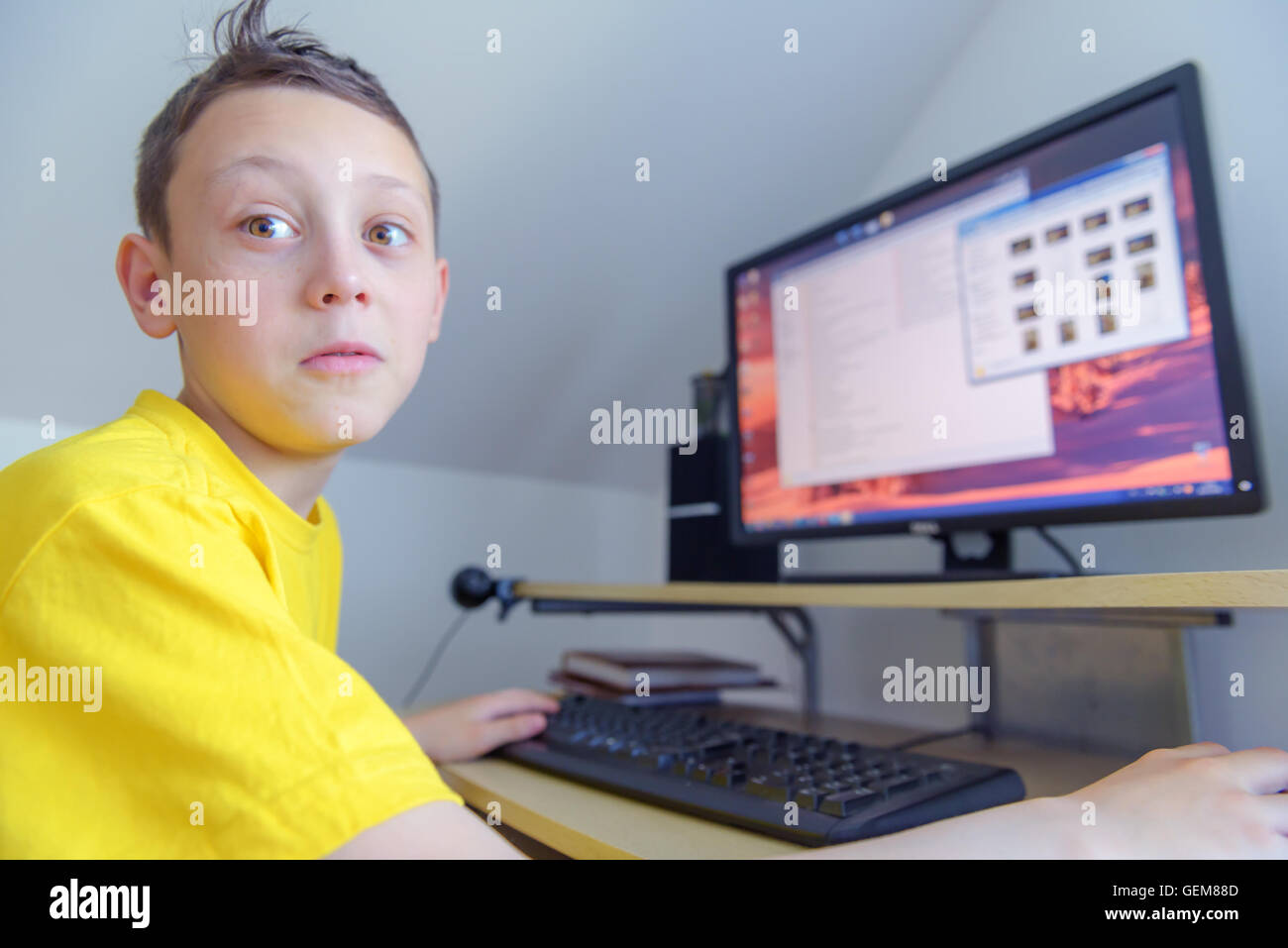 Boy working on computer in his room Stock Photo - Alamy