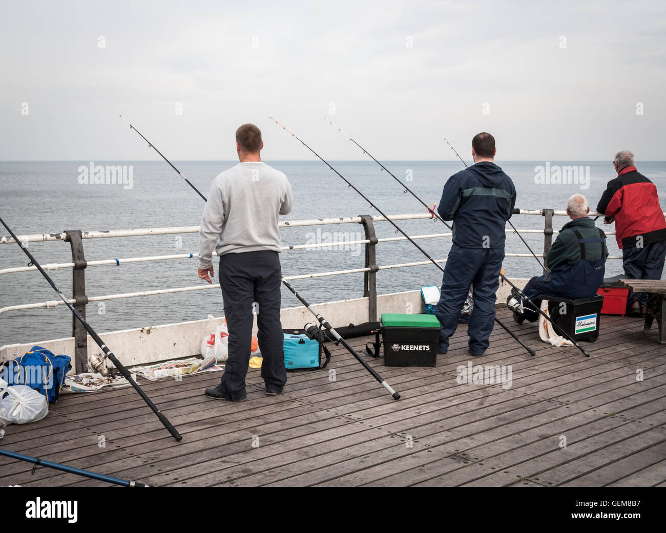 Men fishing from Saltburn`s Victorian pier. Saltburn by the sea, North ...