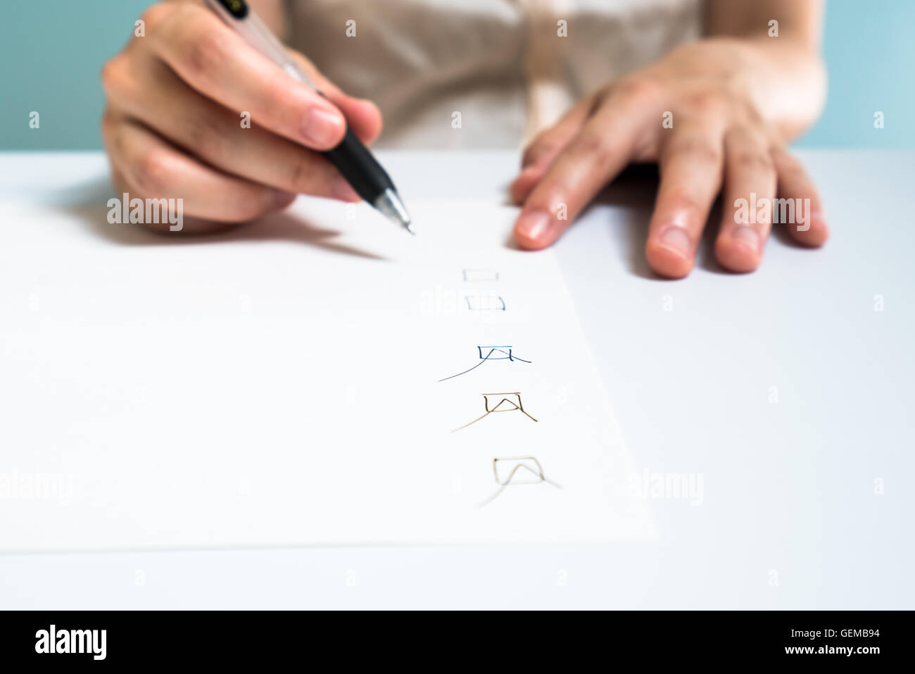 Woman writing check list hi-res stock photography and images - Alamy