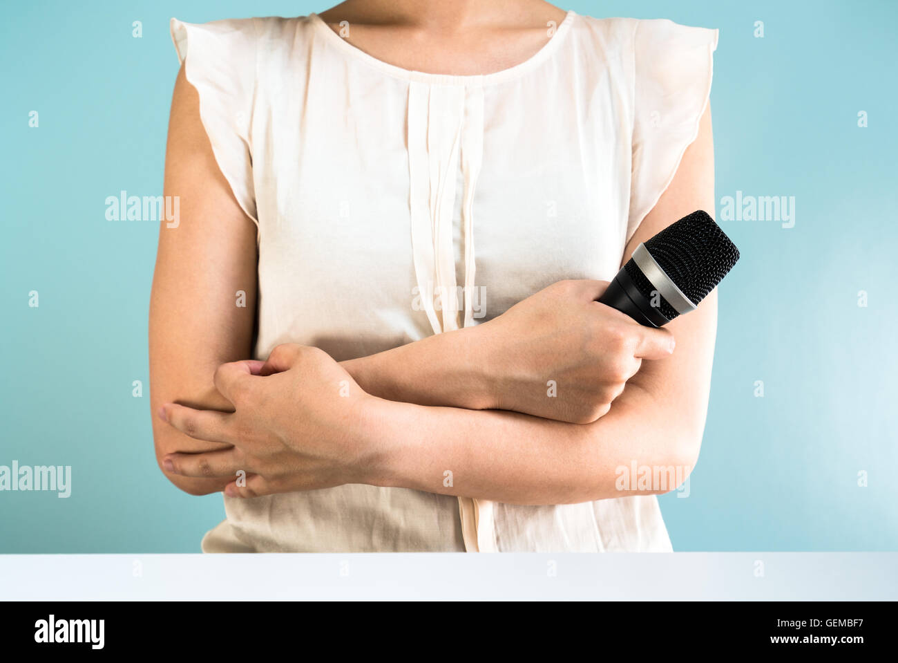 Woman holding microphone Stock Photo - Alamy