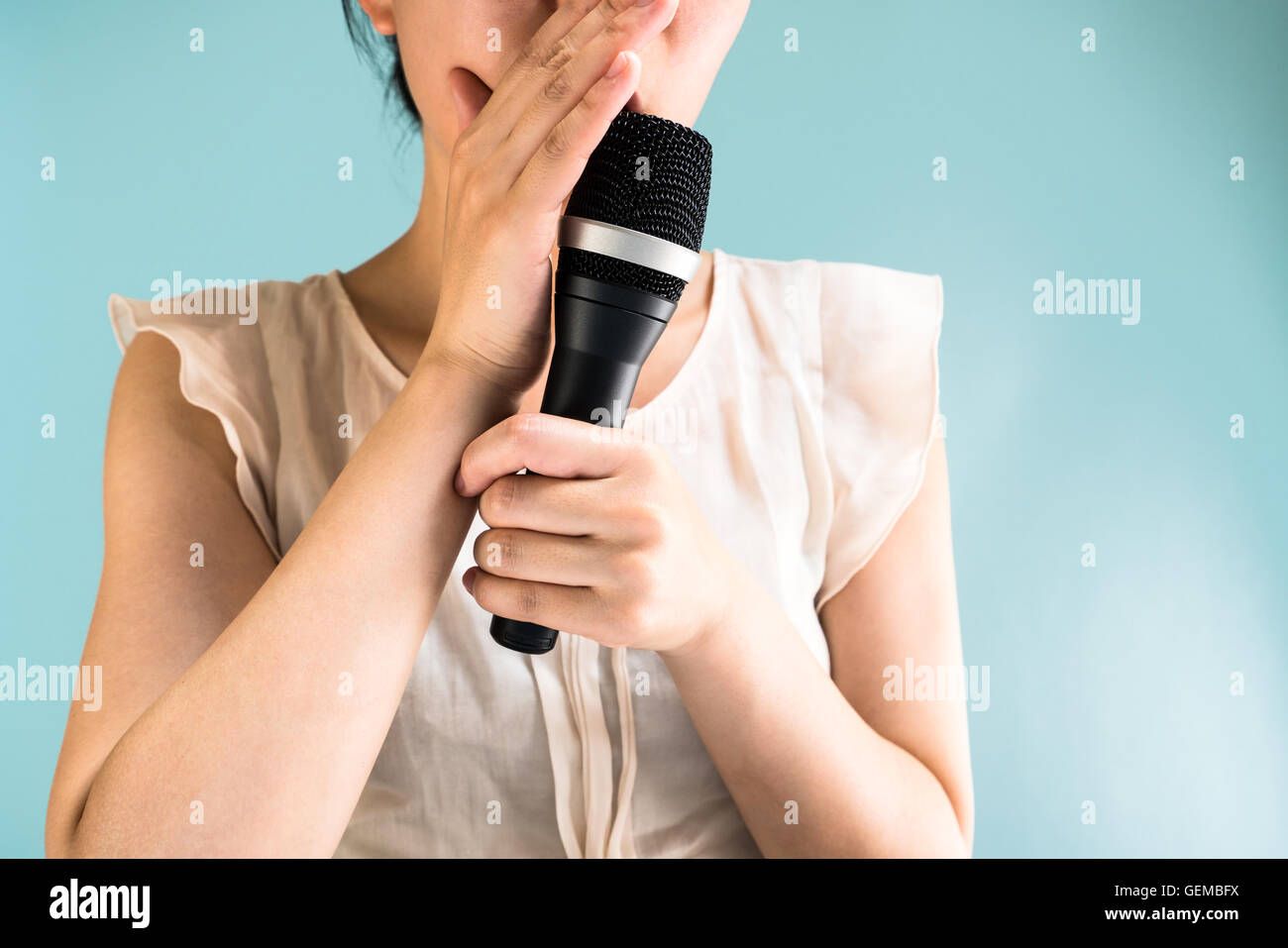 Woman speaking secretly Stock Photo - Alamy