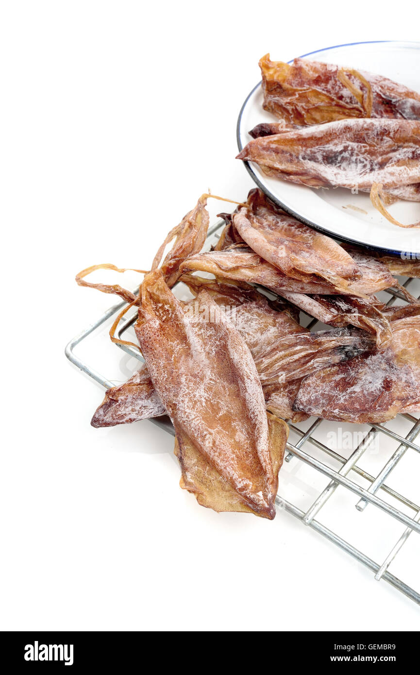 isolate dry squids on white background Stock Photo - Alamy