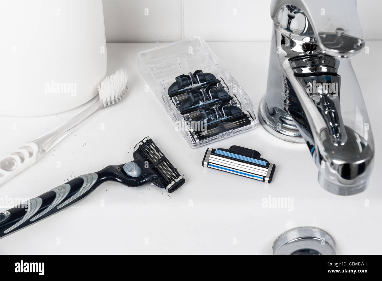 closeup new multiple blade razor in the bathroom Stock Photo - Alamy