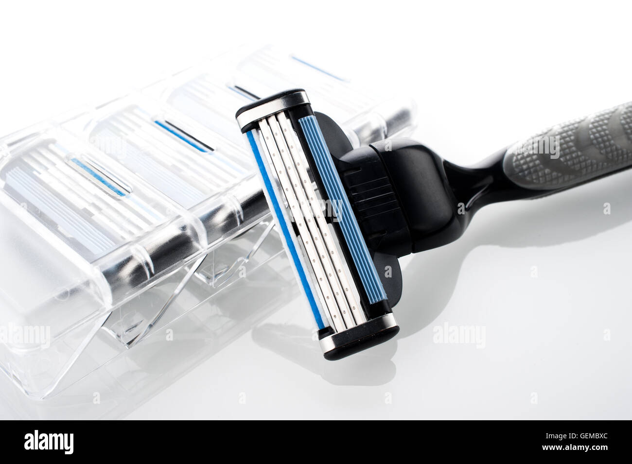 closeup new multiple blade razor on white background Stock Photo - Alamy