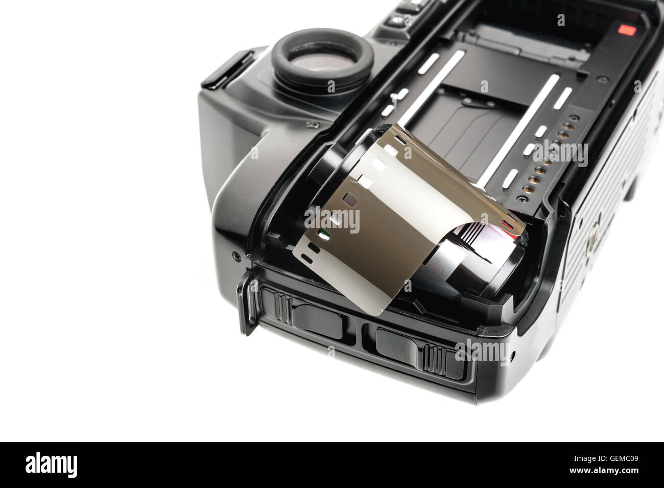 closeup camera film and black camera with opened back lid on white ...