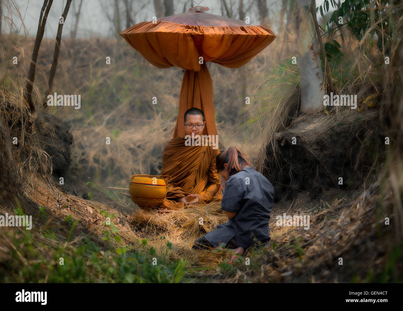 Asian woman worship a monk,monk sitting meditation in dry canal Stock ...