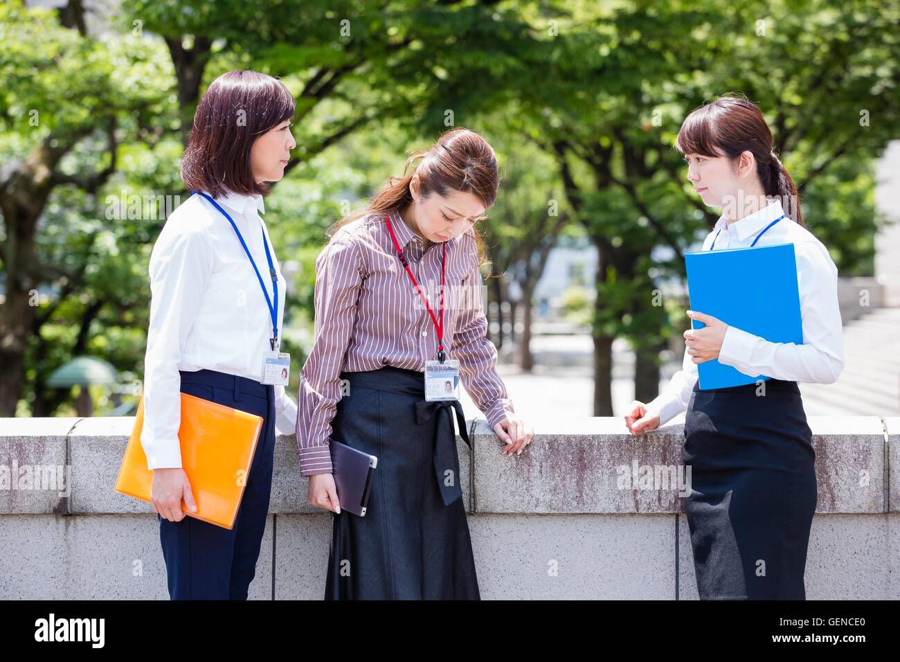 Business women standing outside Stock Photo - Alamy