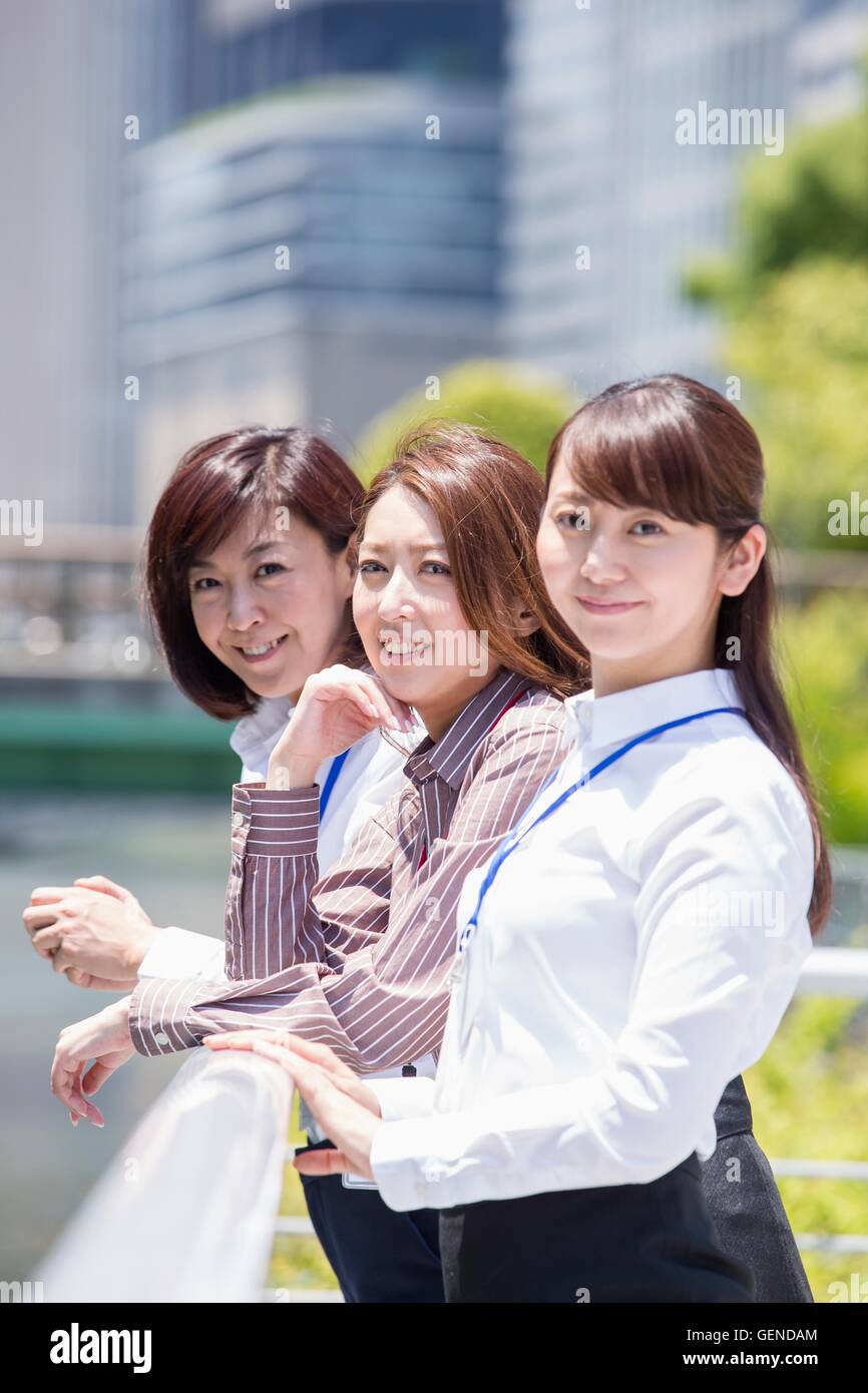 Business women standing outside Stock Photo - Alamy