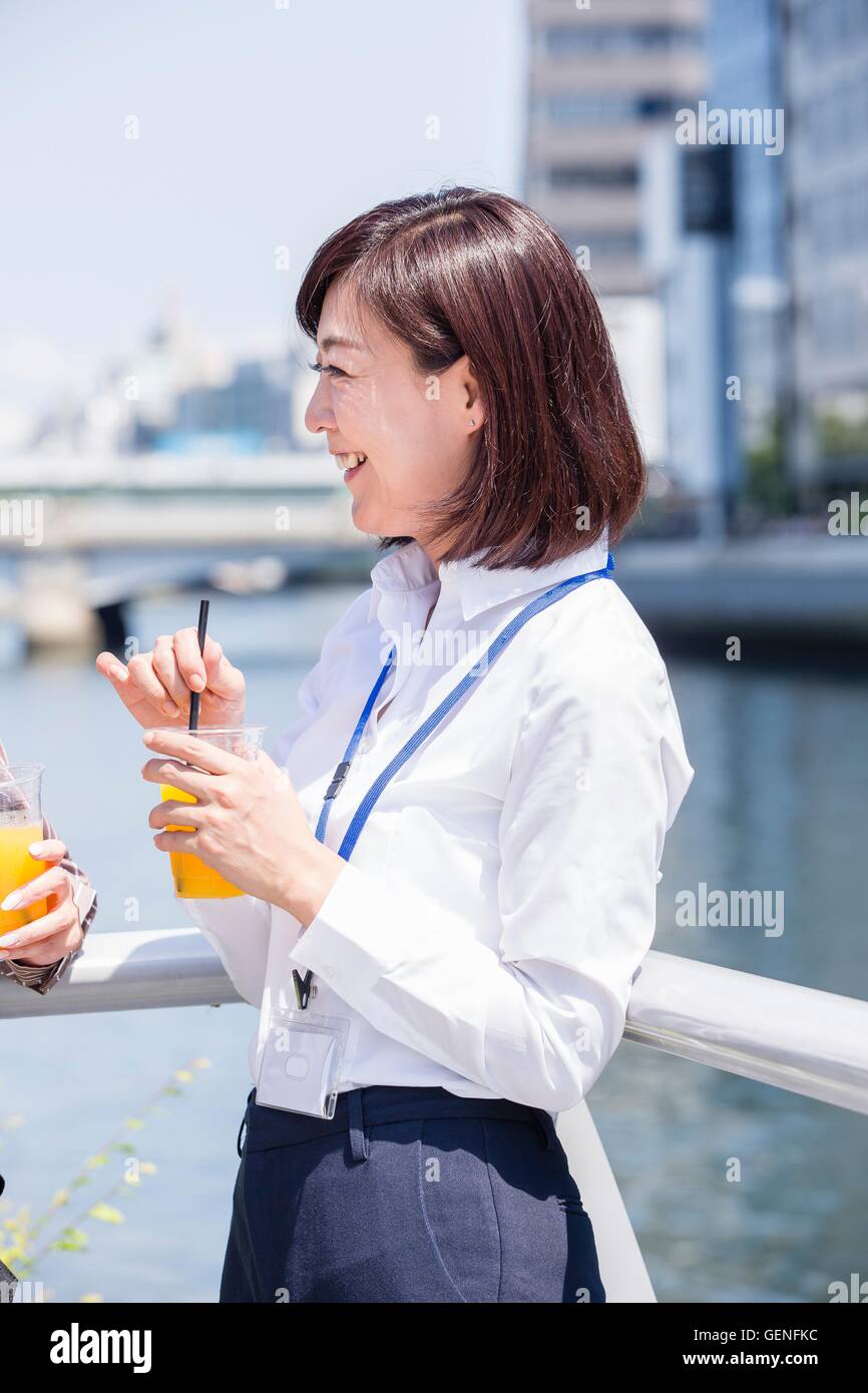 Business women talking outside Stock Photo - Alamy