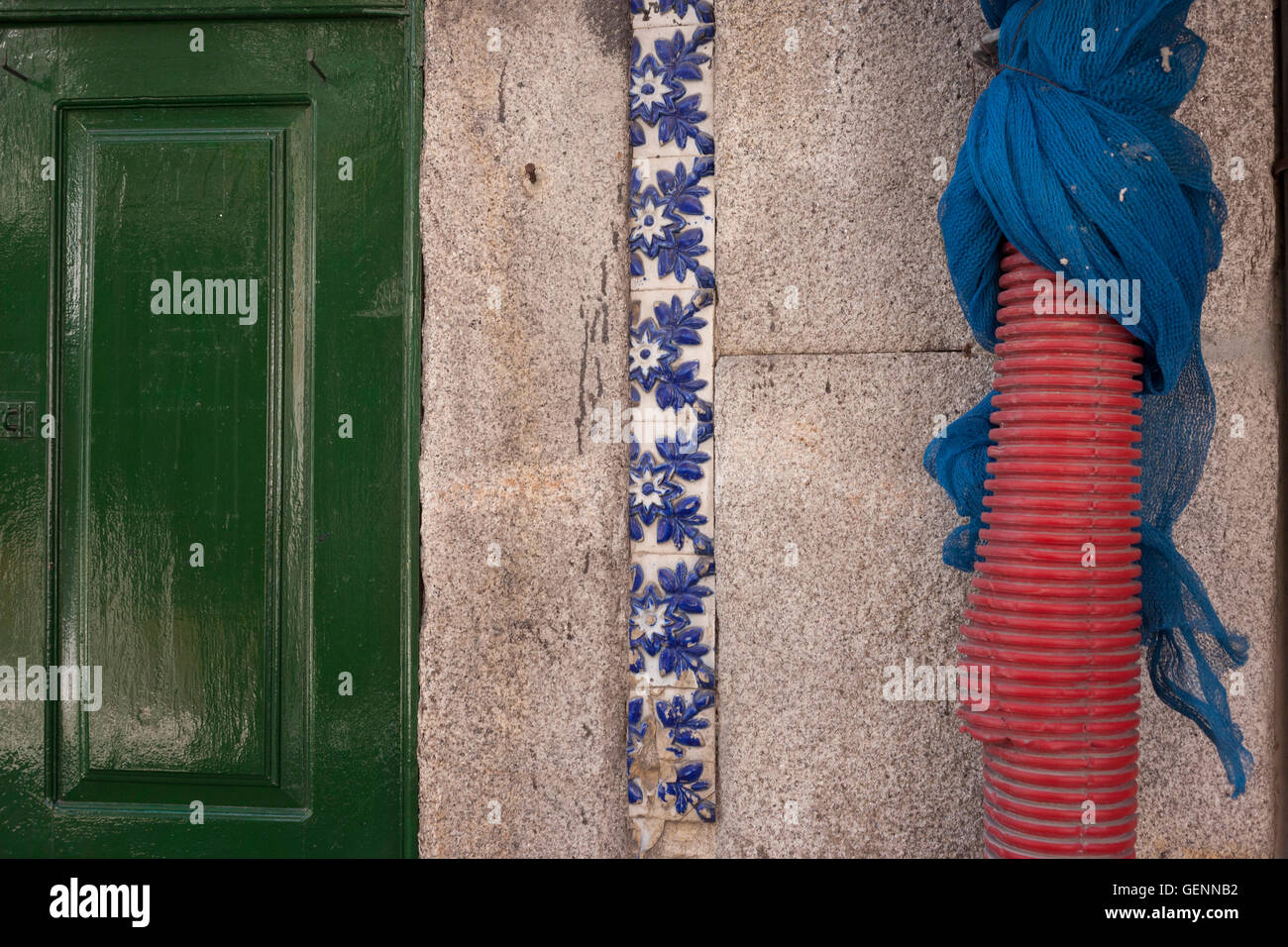Construction sleeves protecting drainpipes outside a home in Porto ...