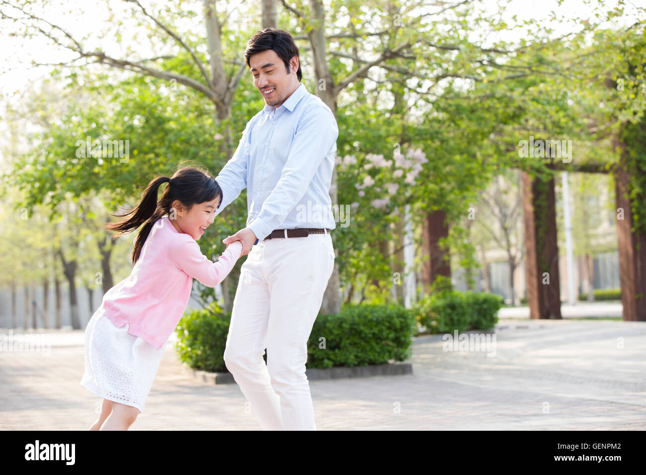 Happy Chinese father and daughter playing Stock Photo - Alamy