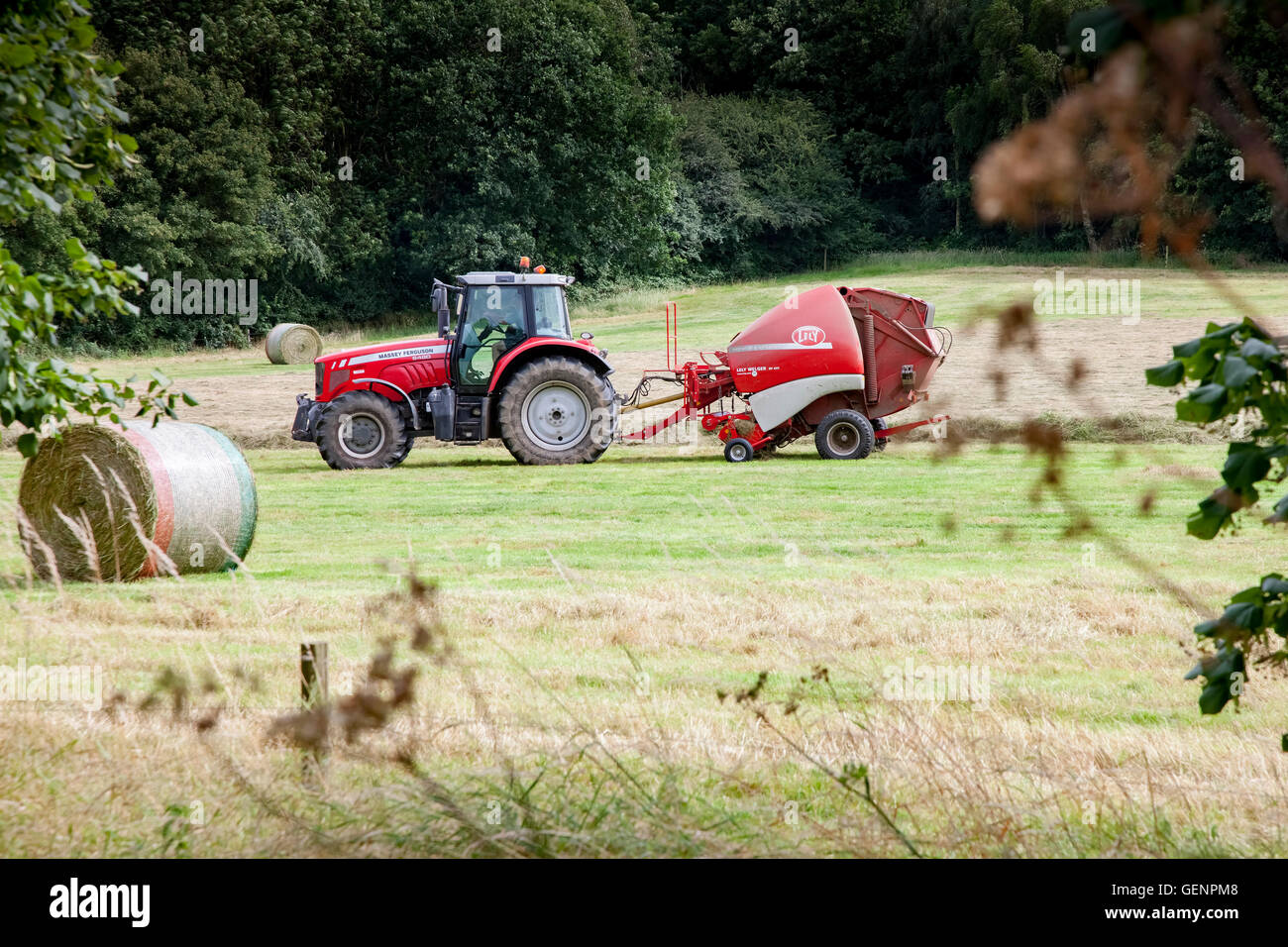 Massey Ferguson tractor and Lely Welger RP435 Baler Stock Photo - Alamy