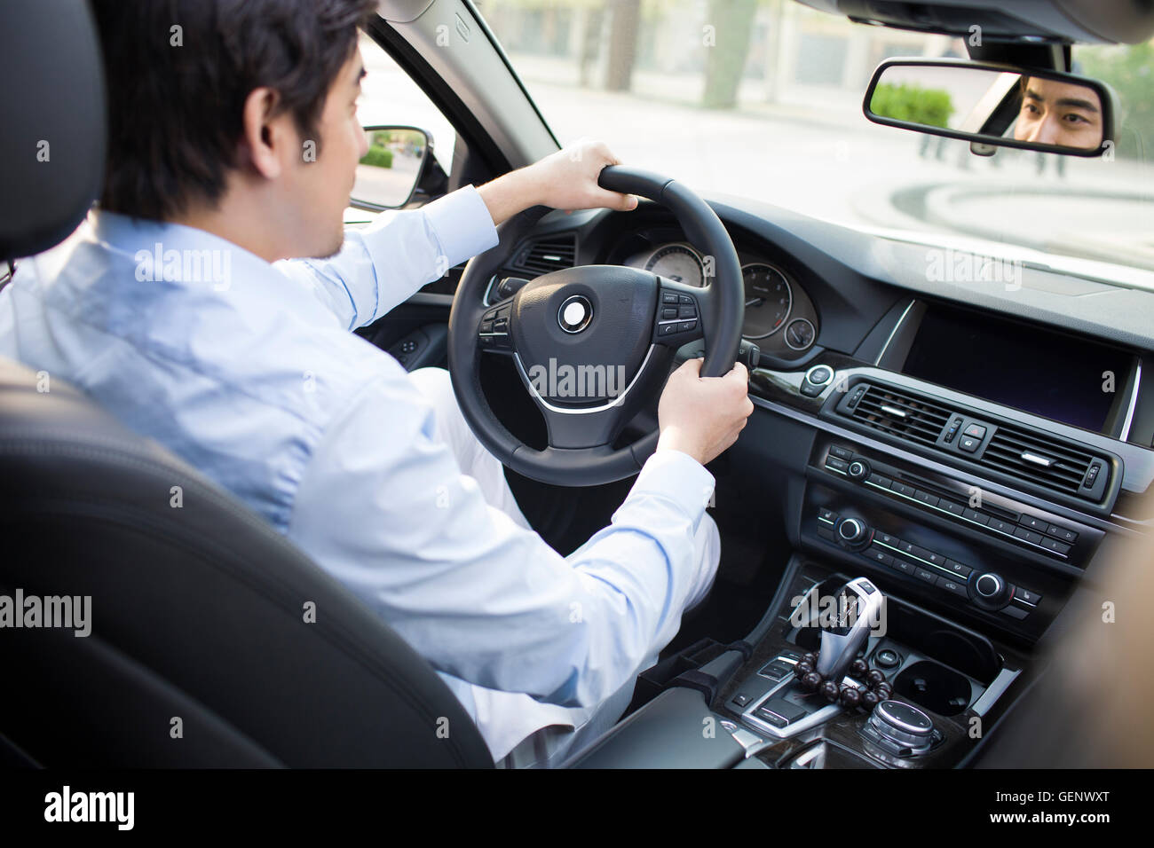 Indian man driving car hi-res stock photography and images - Alamy