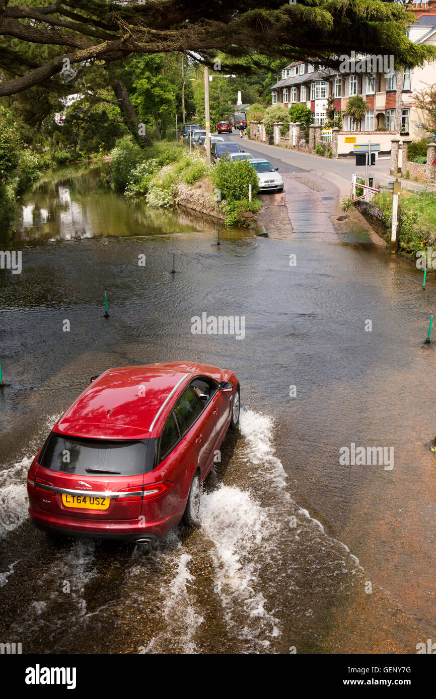 Red car passing across hi-res stock photography and images - Alamy