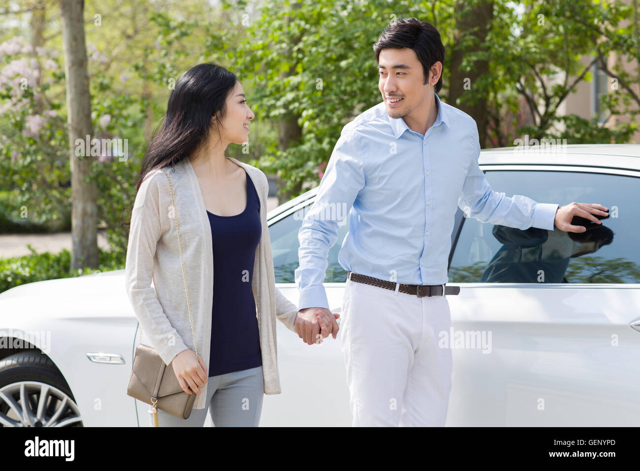 Happy young Chinese couple and car Stock Photo - Alamy