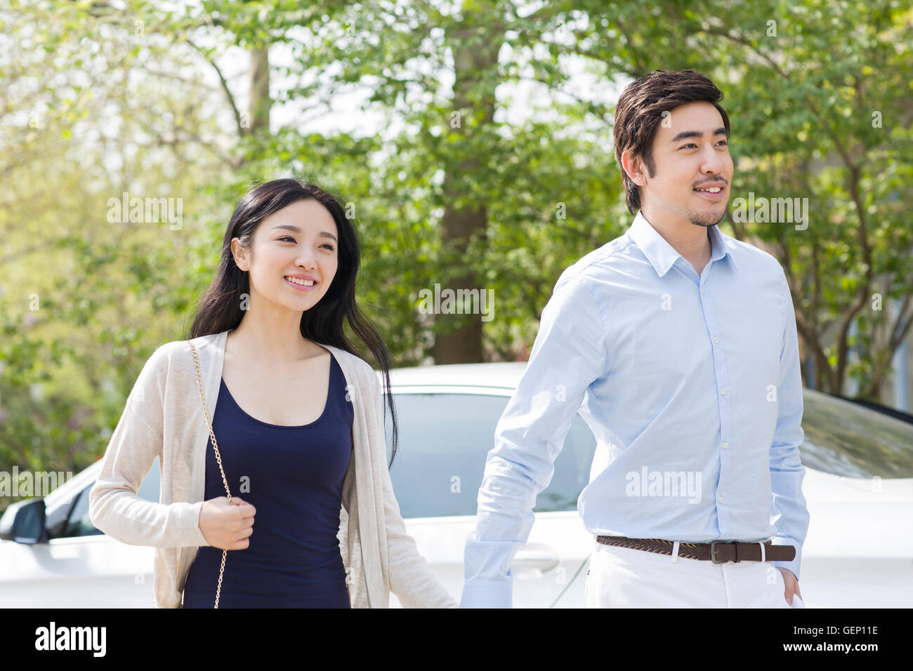 Walking holding transportation arrival hands in pockets hi-res stock ...