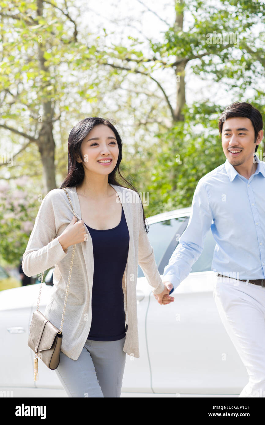 Happy young Chinese couple and car Stock Photo - Alamy