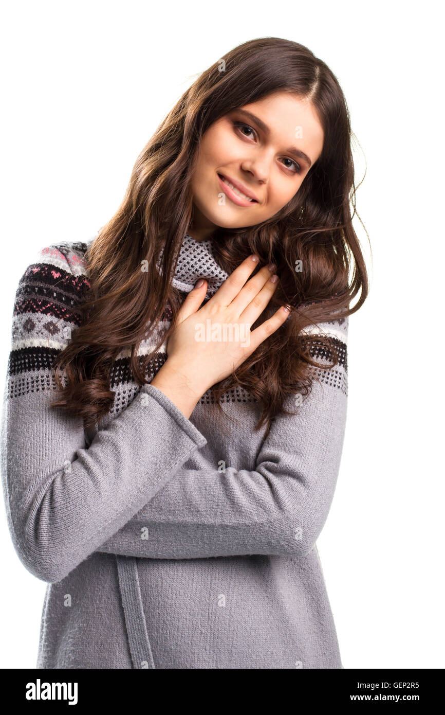 Girl holds hand on chest Stock Photo - Alamy