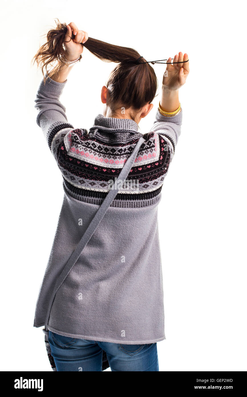 Lady is tying hair Stock Photo - Alamy