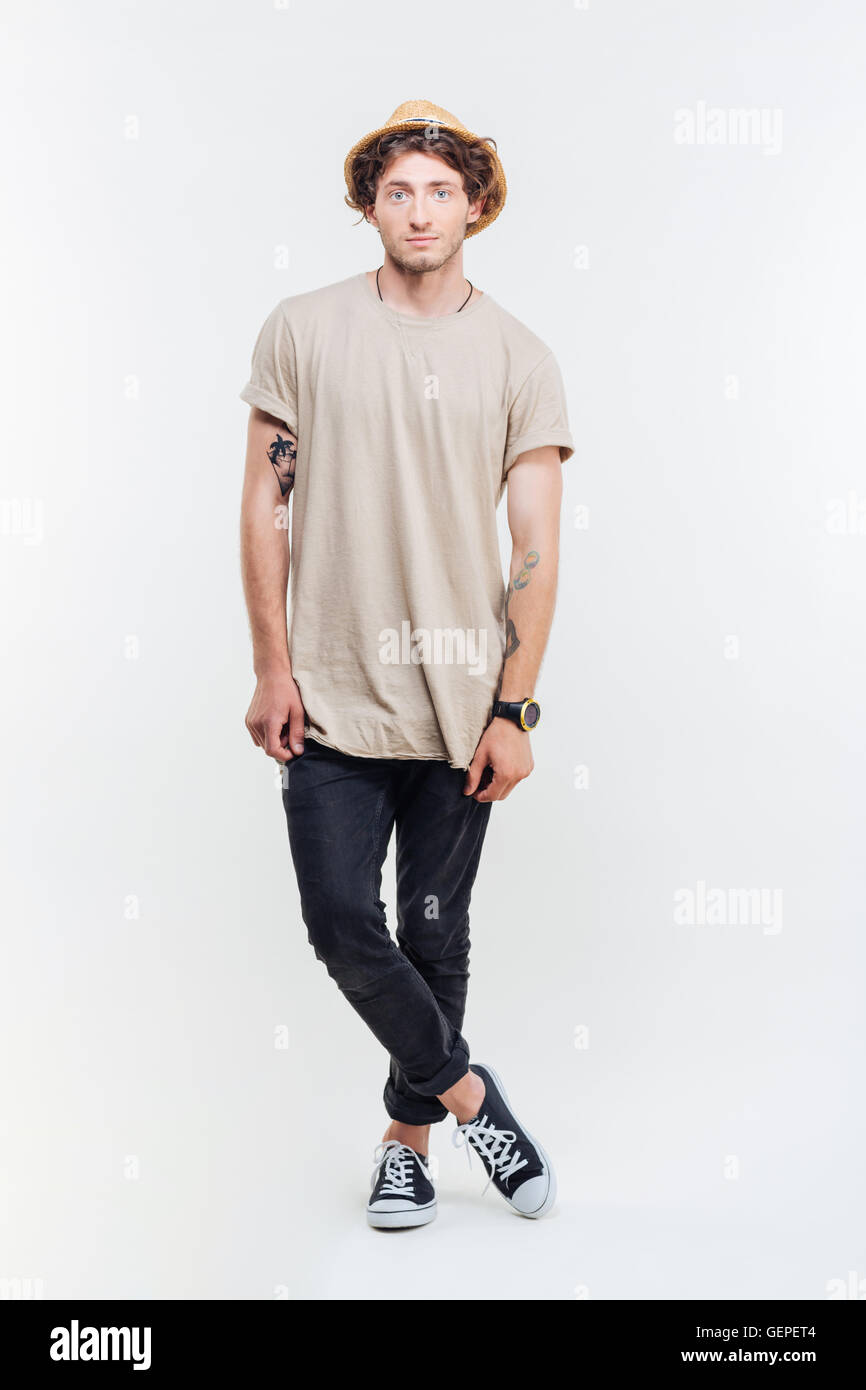 Standing with legs crossed hi-res stock photography and images - Alamy