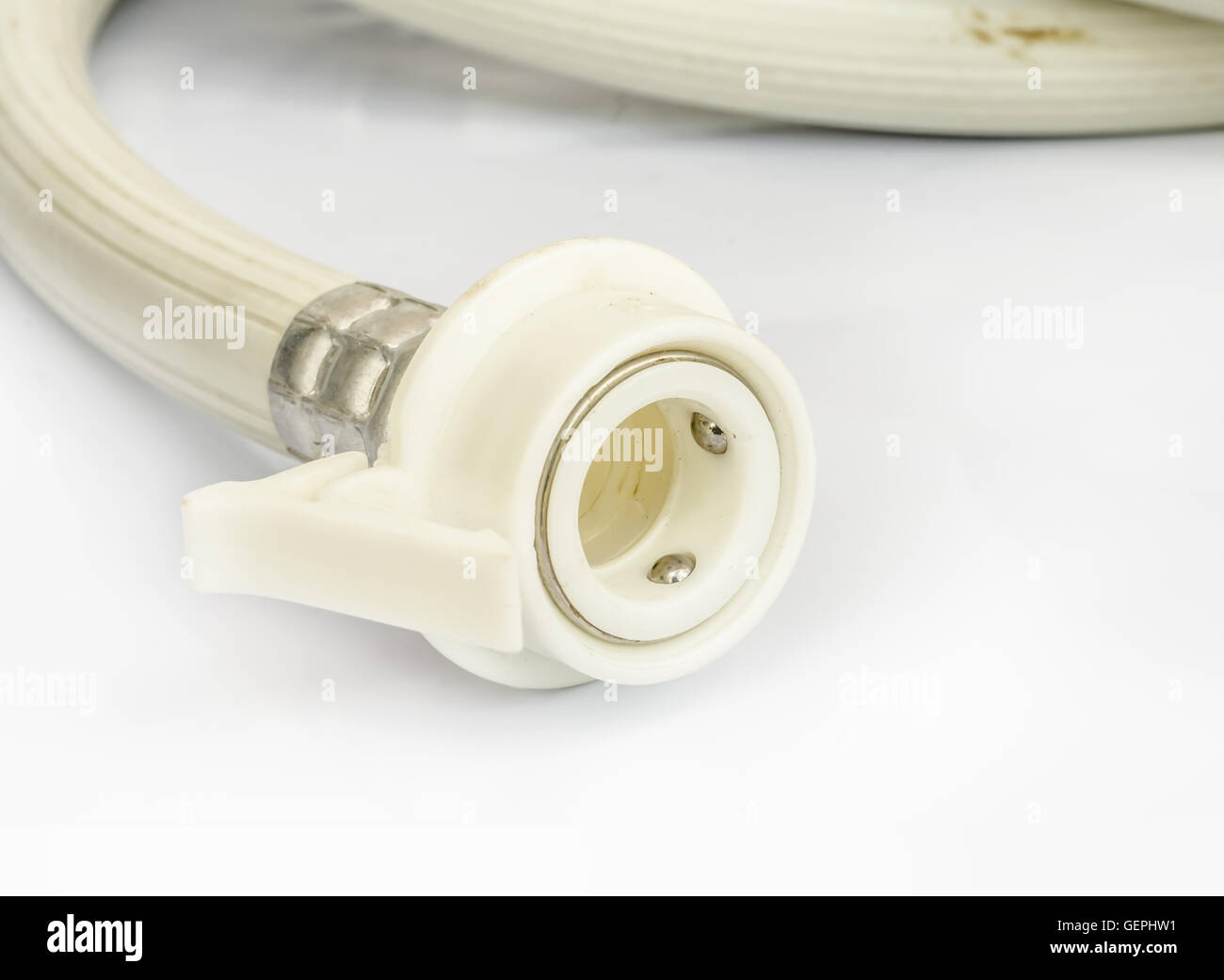 industrial elastic rubber water pipe with connectors on white ...