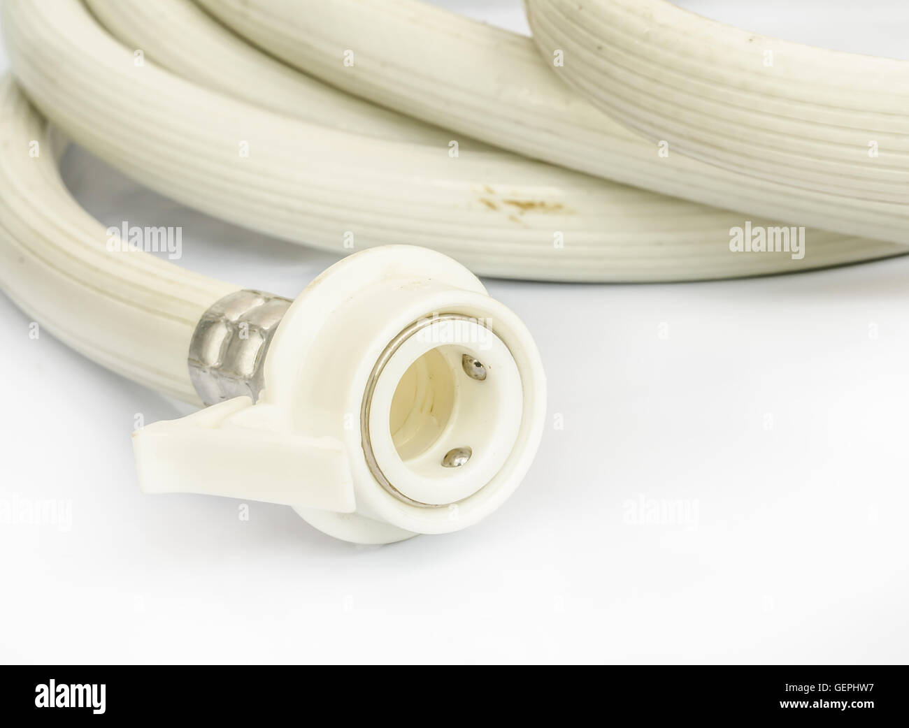 industrial elastic rubber water pipe with connectors on white ...