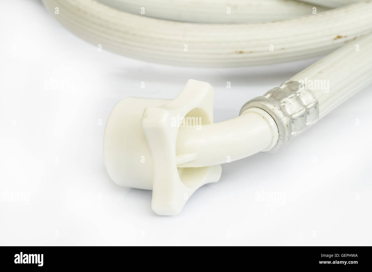 industrial elastic rubber water pipe with connectors on white ...