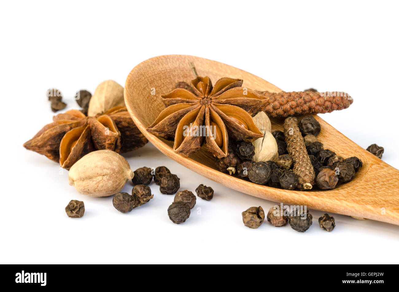 Star Anise and other spices and wood spoon Stock Photo - Alamy