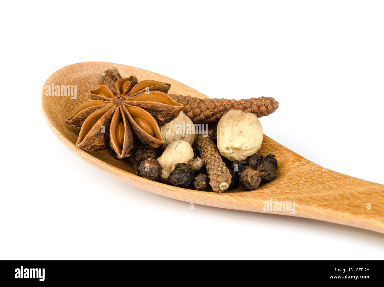 Star Anise and other spices and wood spoon Stock Photo - Alamy
