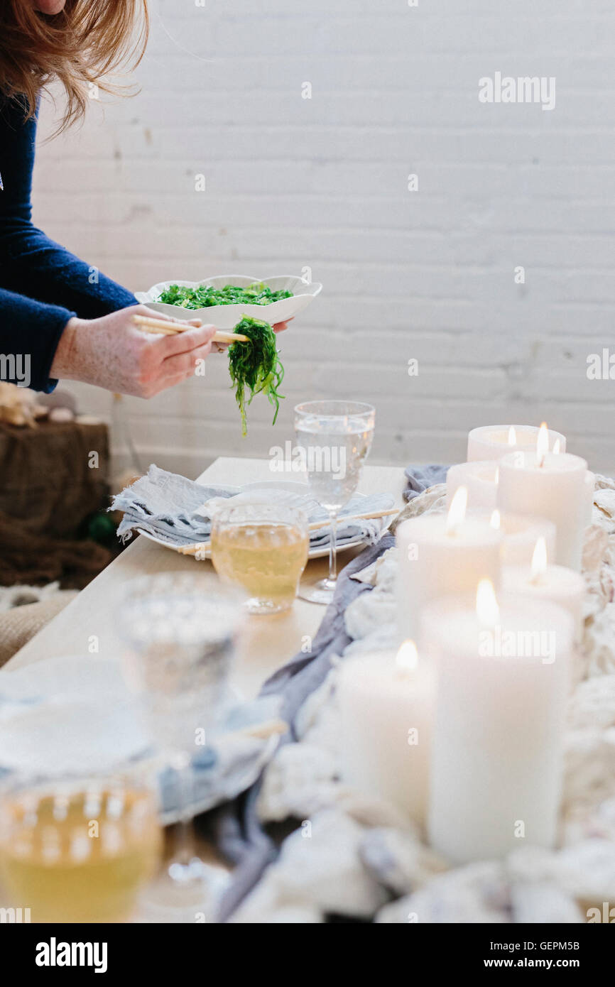 Woman setting a table for a meal hi-res stock photography and images ...