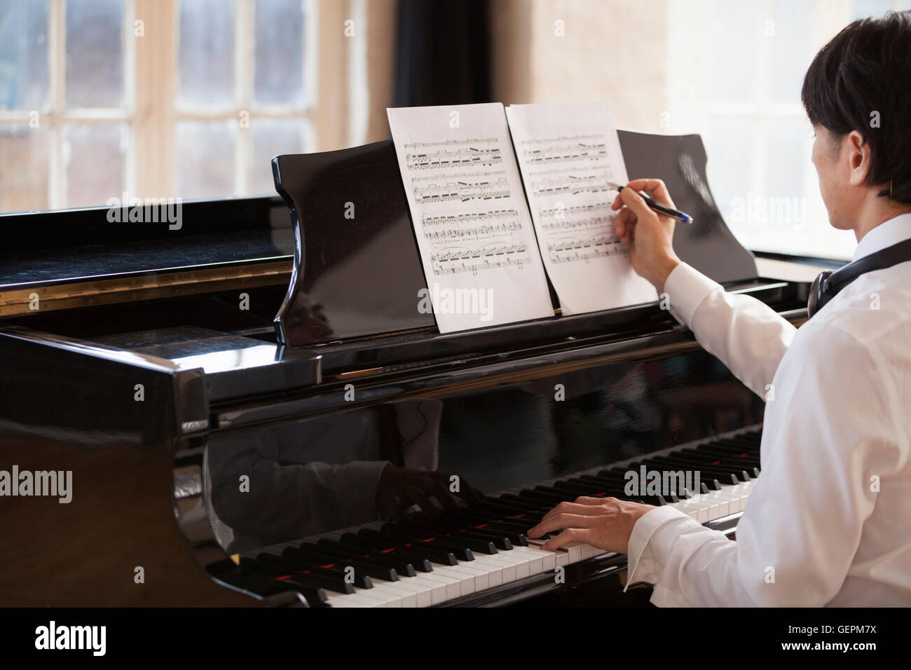 Asian man sitting piano hi-res stock photography and images - Alamy