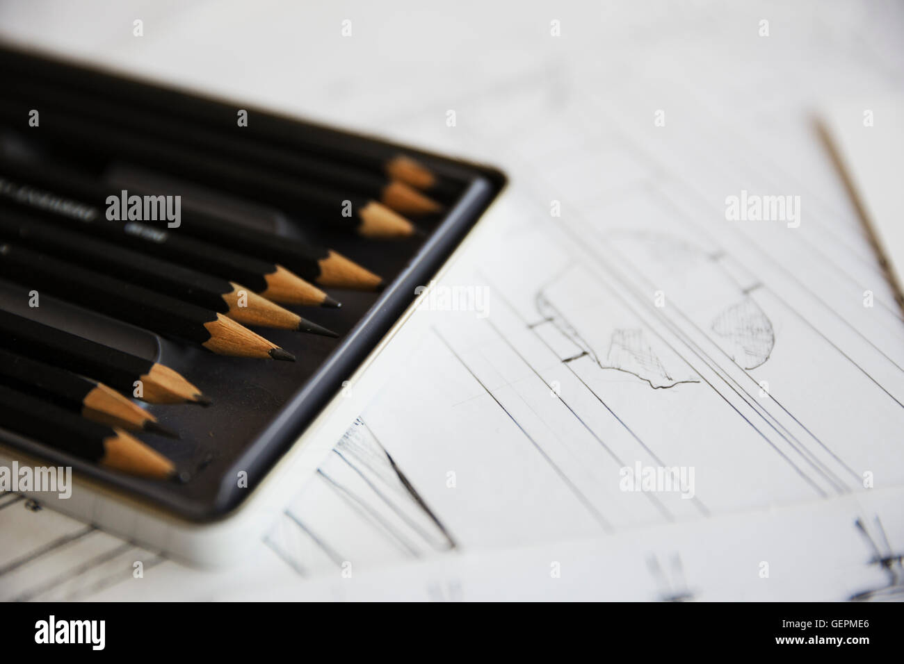 Close up of design drawings for furniture and a tray of pencils Stock ...