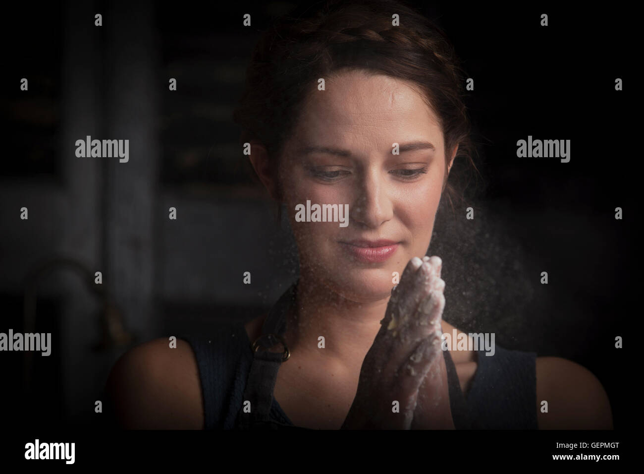 Valentine's Day baking, close up portrait of a young woman with dough on her hands Stock Photo ...