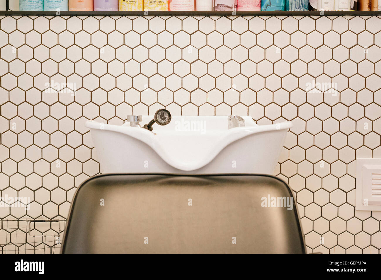 A hair salon hair washing basin and chair Stock Photo - Alamy