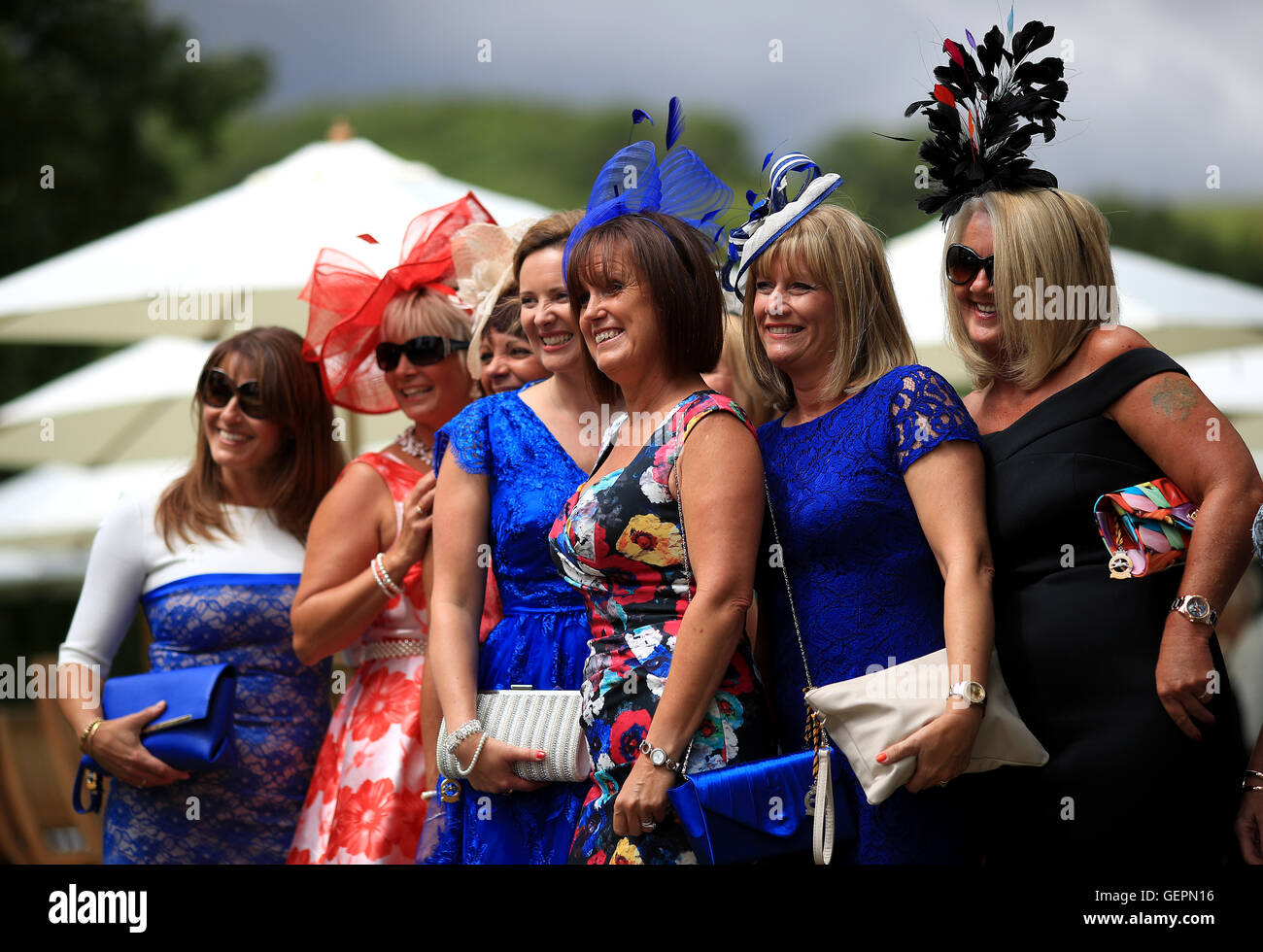 Female racegoers arrive during day one of The Qatar Goodwood Festival ...