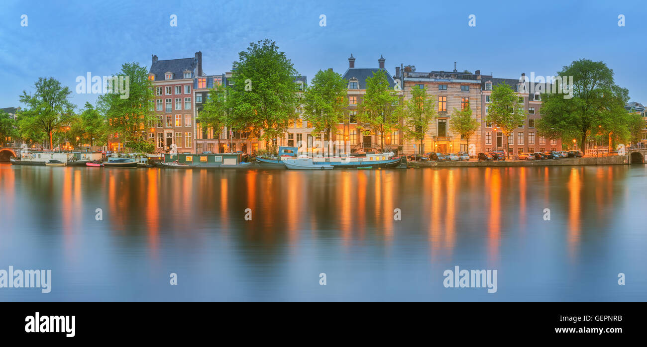 Panoramic view and cityscape of Amsterdam with boats, old buildings and ...