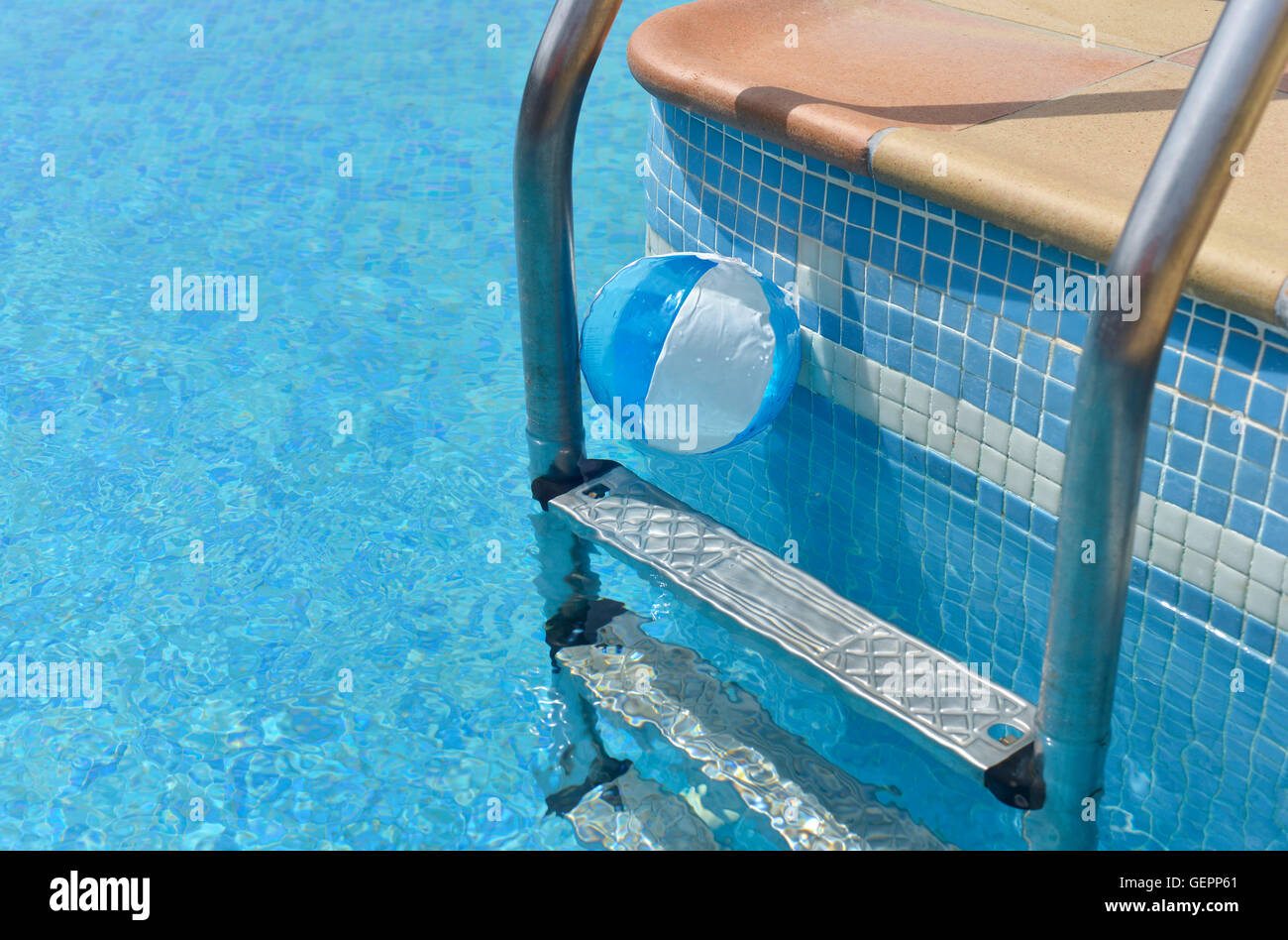 Ball floating in swimming pool Stock Photo - Alamy