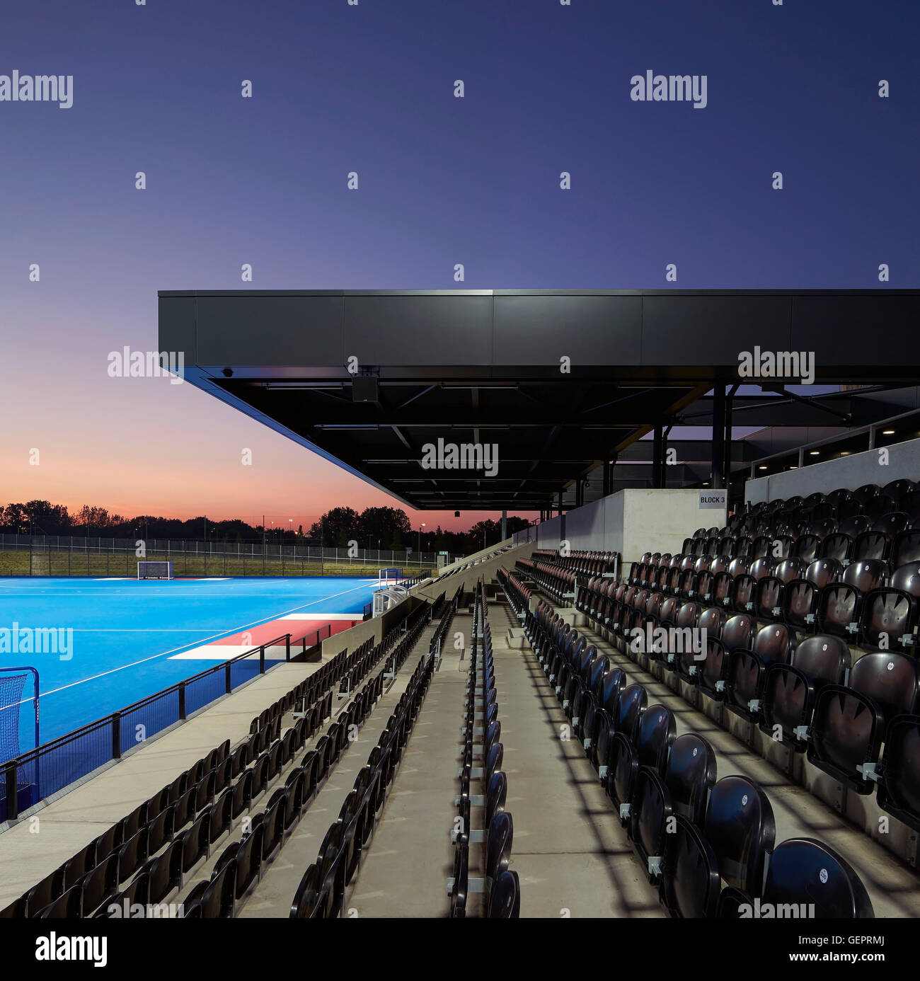 Night elevation of spectator stand with canopy and sports field. Eton ...