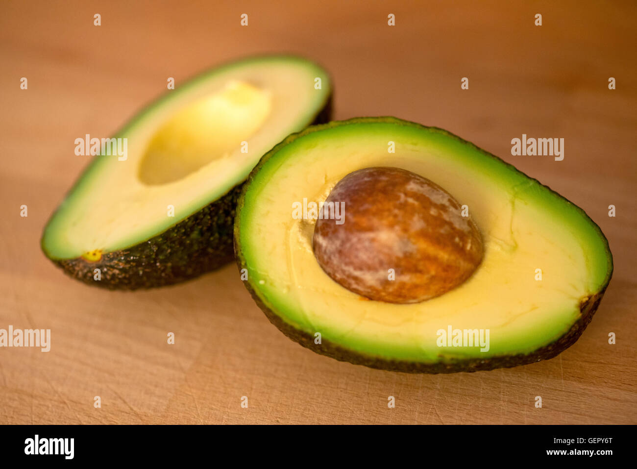 An avocado cut in half Stock Photo - Alamy