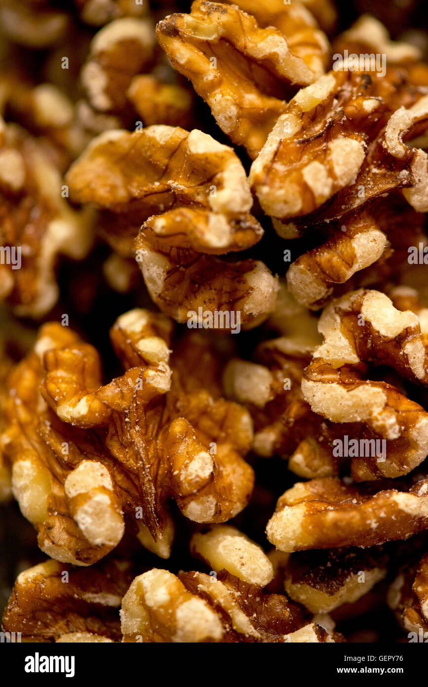 Lot of walnuts close up background Stock Photo - Alamy