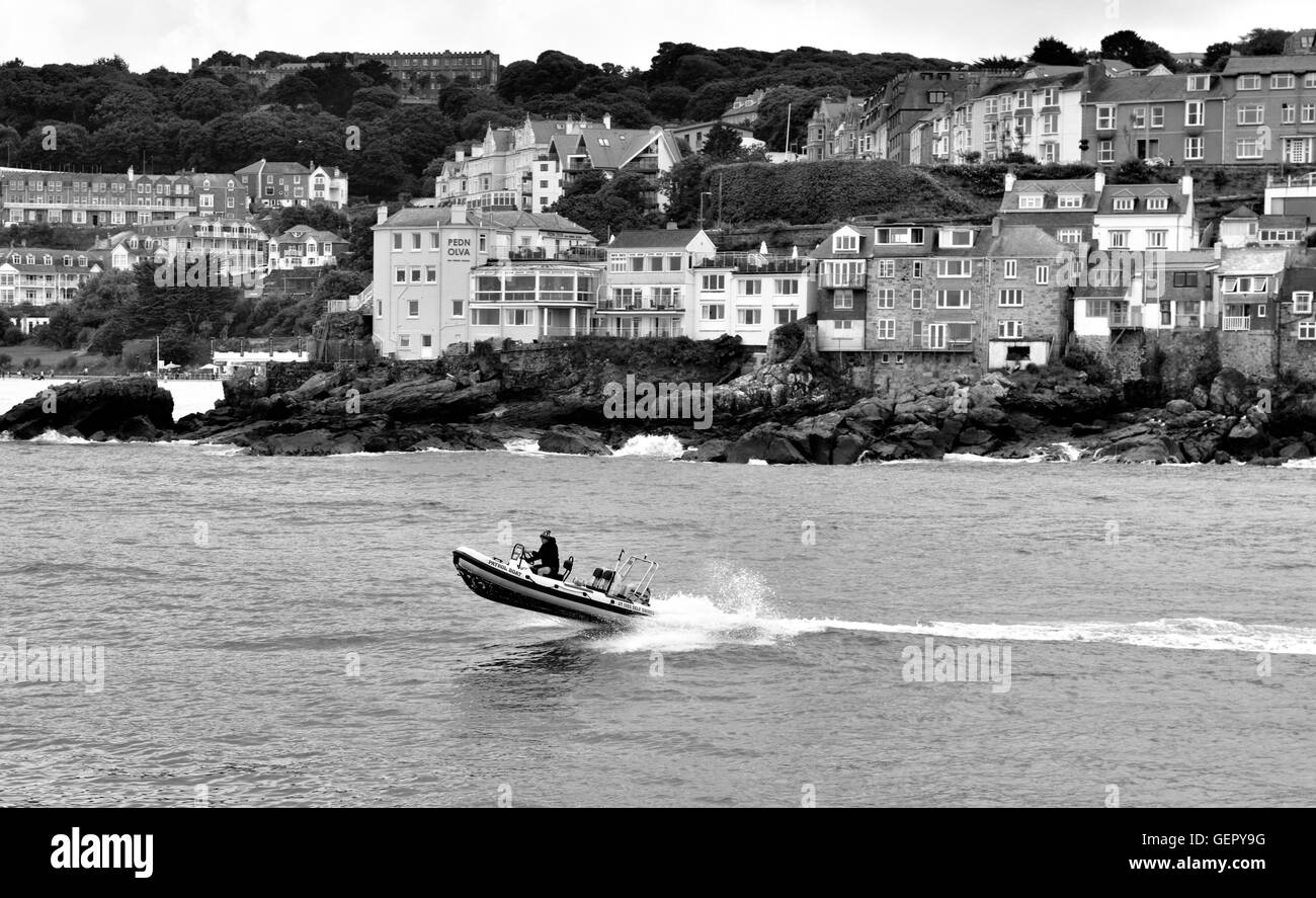A speed boat speeding across the bay in St Ives Cornwall England UK ...