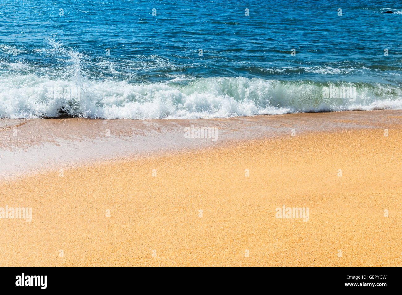 Soft wave of the sea on the sandy beach Stock Photo - Alamy